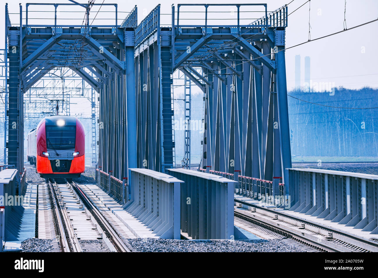 Modern high-speed train moves through the bridge. Moscow. Russia Stock ...