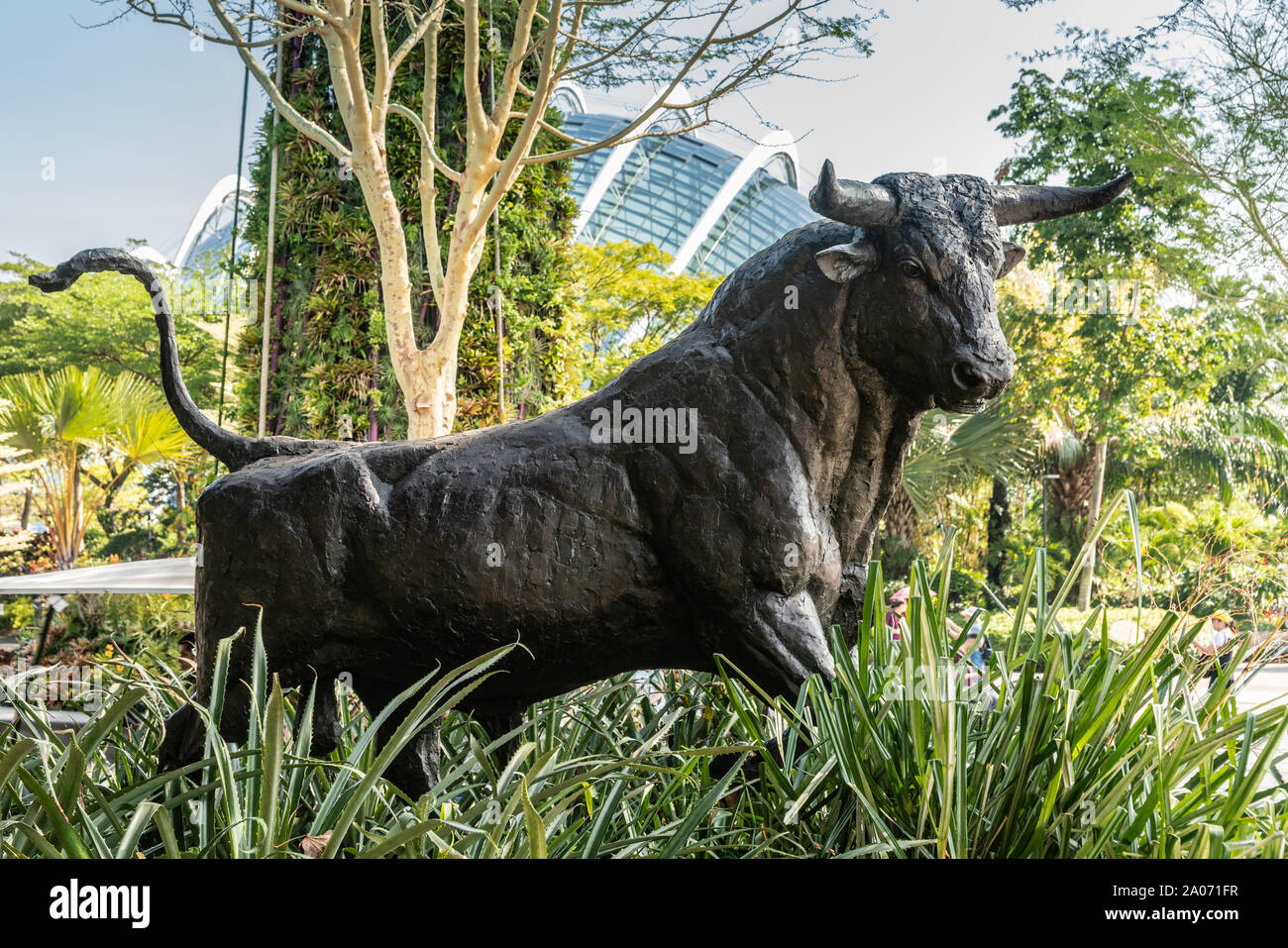 Singapore - March 22, 2019: At Gardens by the Bay. Black statue of bull ...