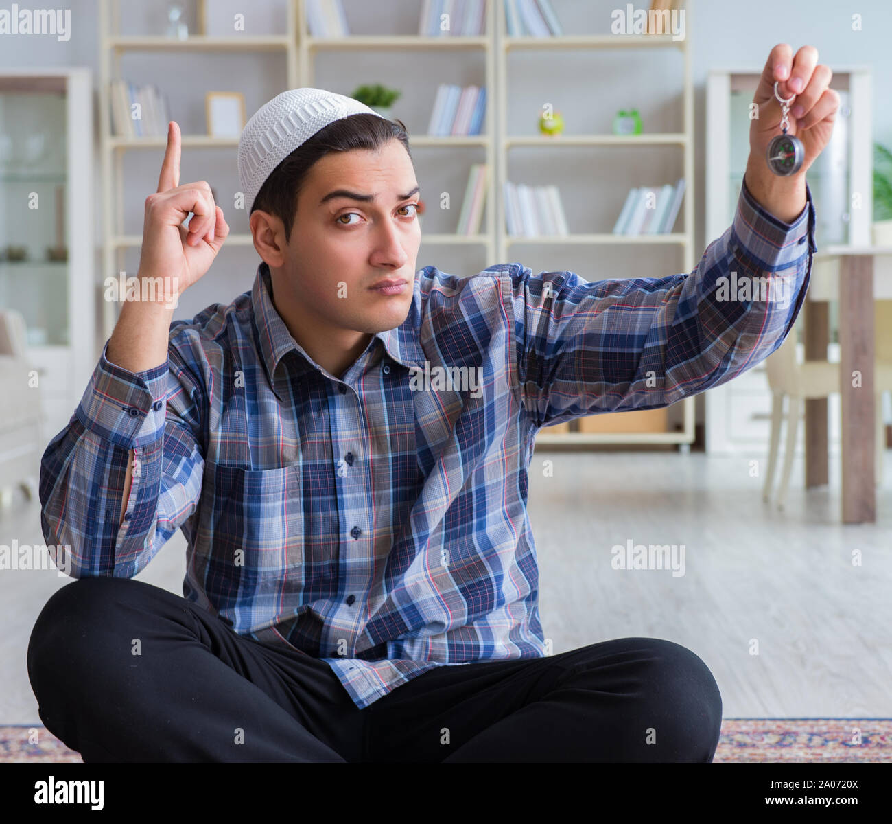 The young muslim man praying at home Stock Photo - Alamy