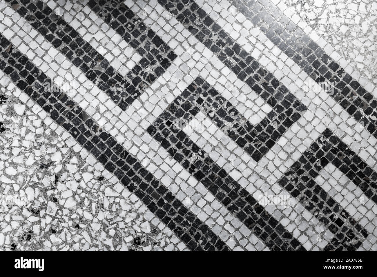 Ancient stone mosaic floor tiling with black and white geometric ...