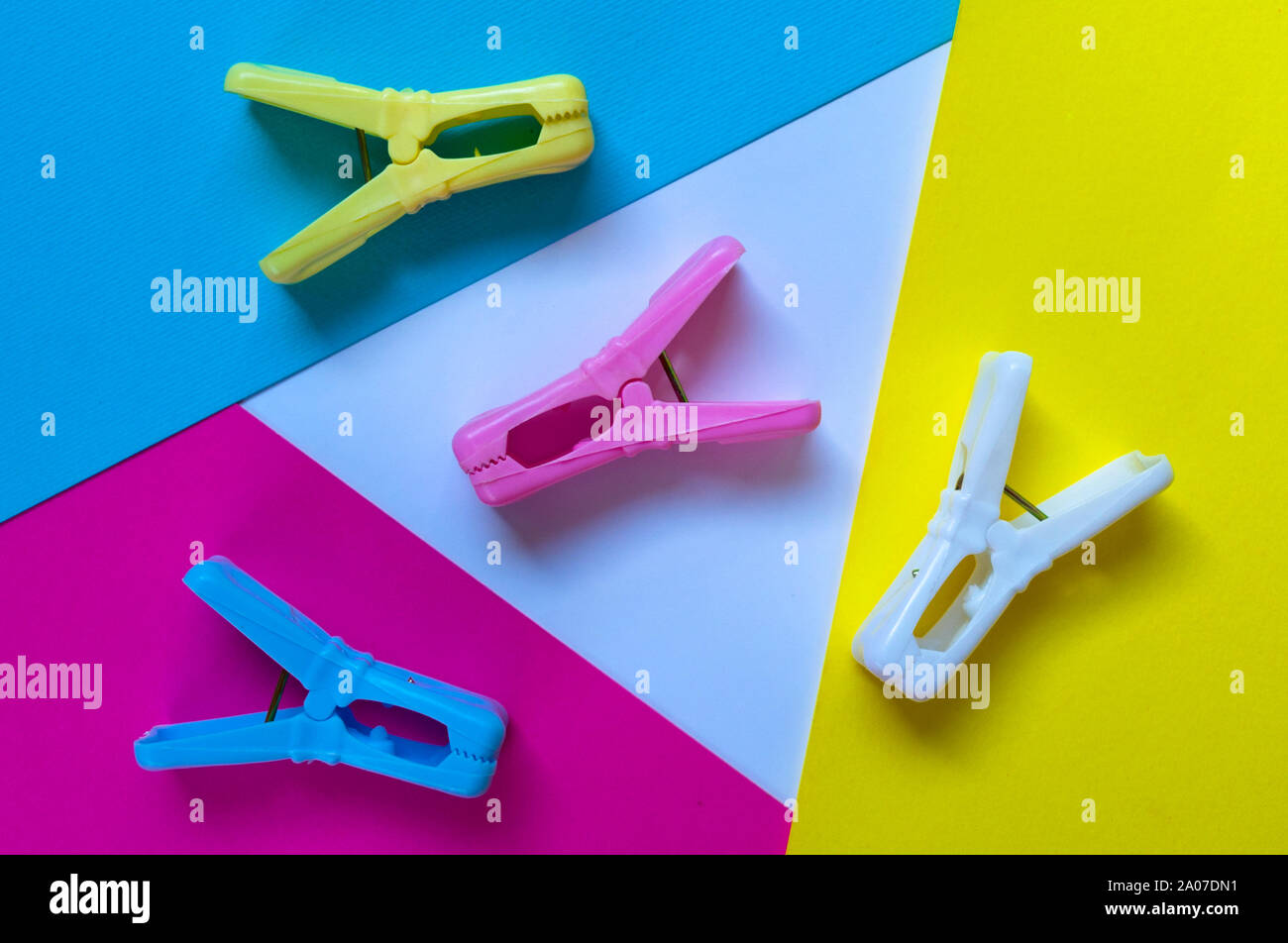 Colored clothespins on a colorful background Stock Photo - Alamy