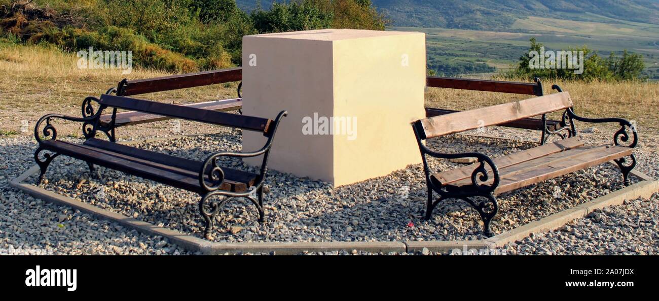 Lookout point with wooden benches on top of the mountain in Romania ...