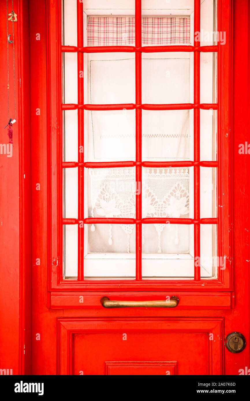 Traditional colorful red door in the narrow streets of old city Stock ...