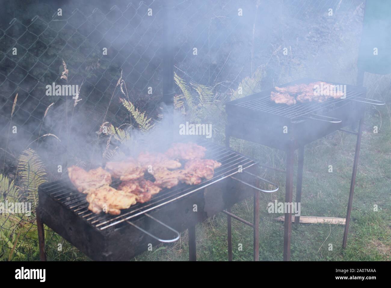 Old and rusty barbecue with charcoal prepared for roasting meat Stock ...