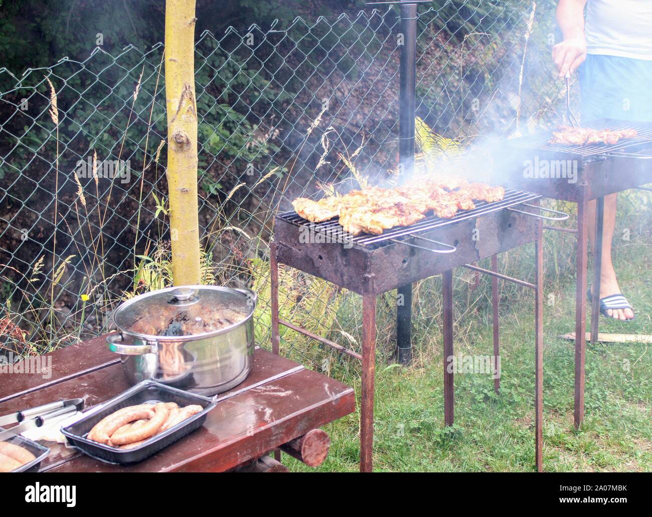Old and rusty barbecue with charcoal prepared for roasting meat Stock ...