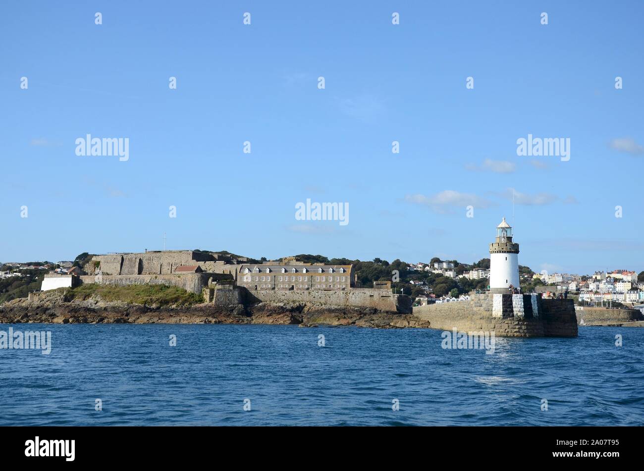 The lighthouse and Castle Cornet Breakwater, St Peter Port harbour ...