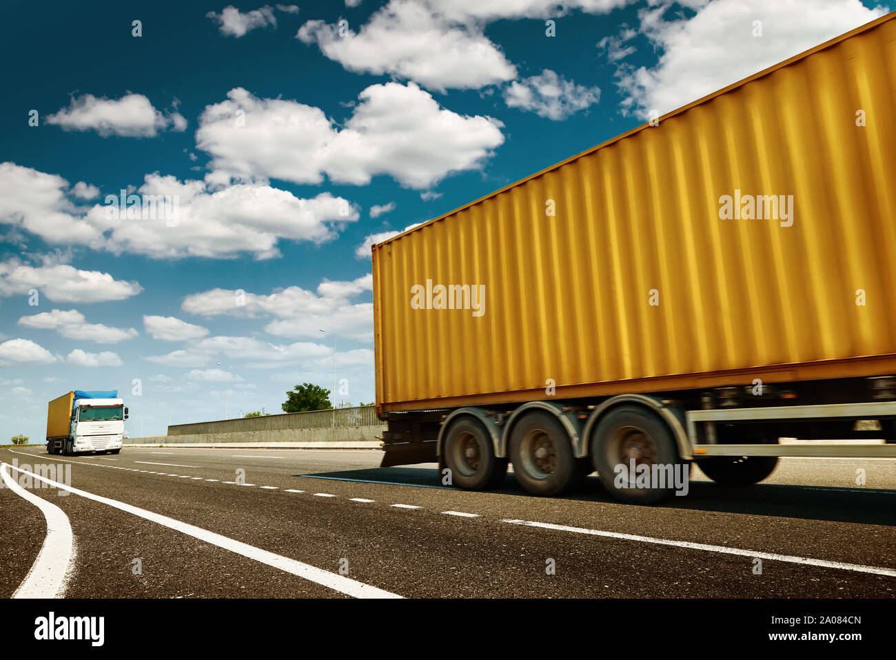 Yellow truck and container is on highway - business, commercial, cargo ...