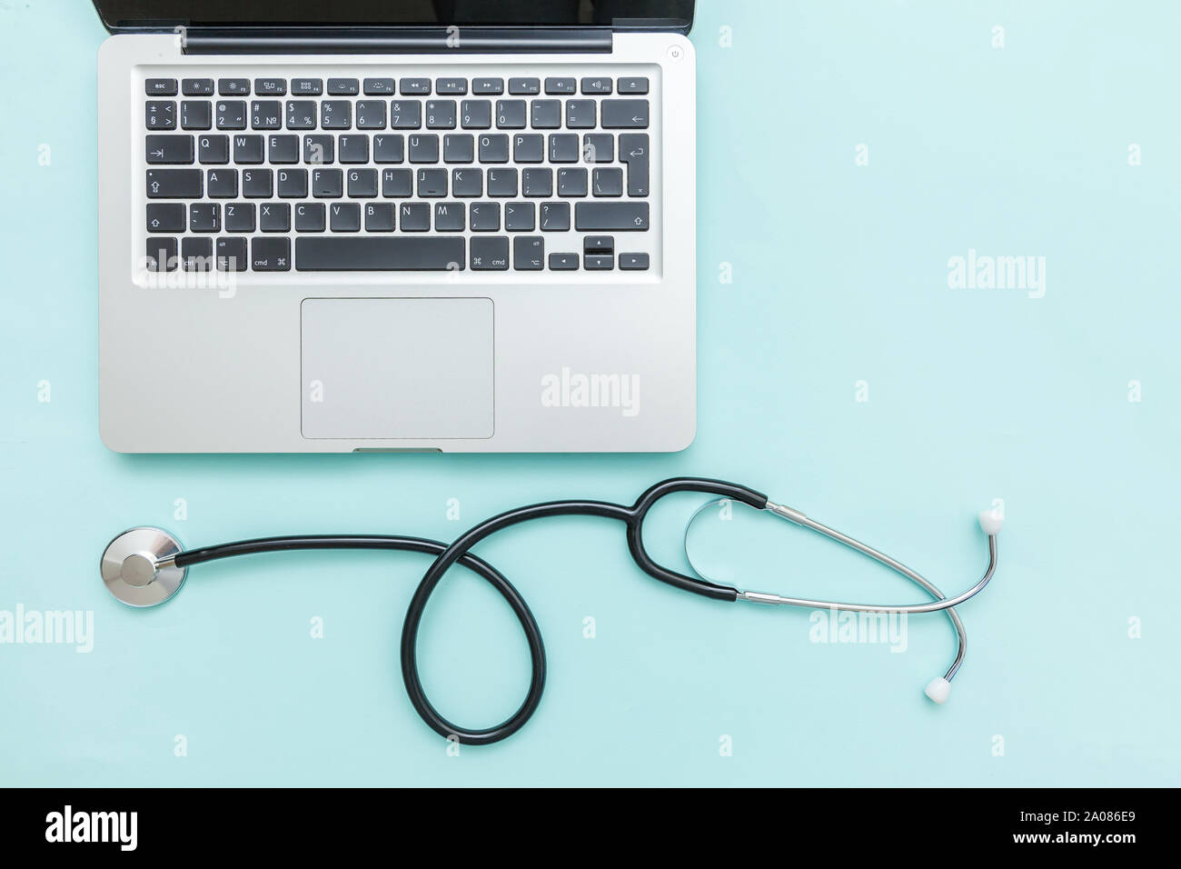 Stethoscope keyboard laptop computer isolated on blue background ...