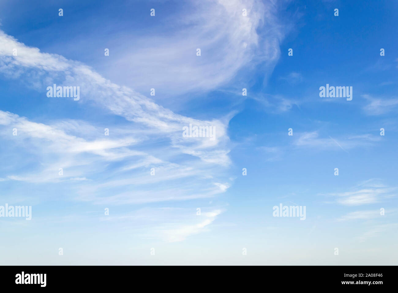 Scenic skyscape with fluffy cirrus and stratus clouds in the ...