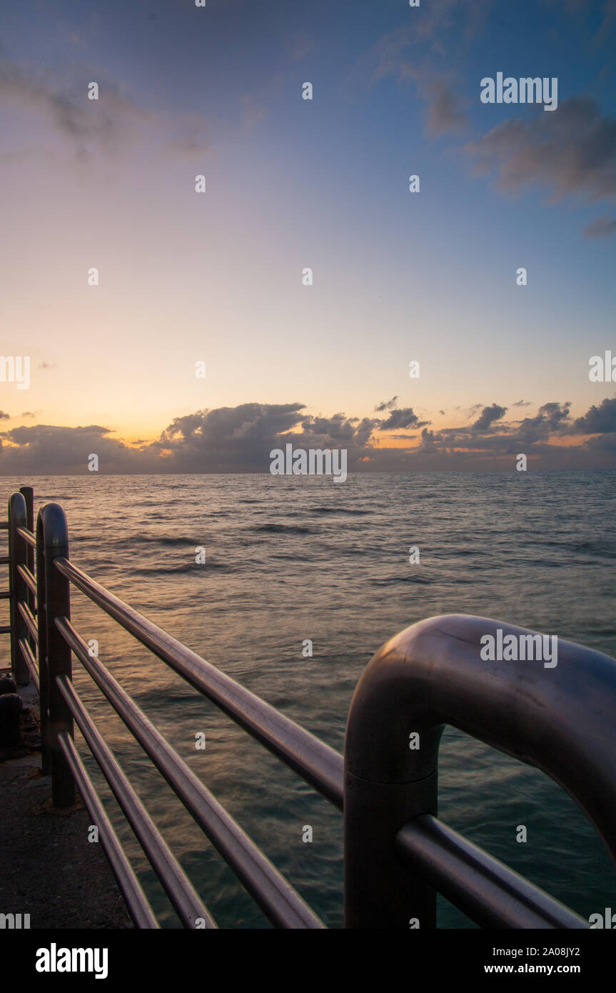 Metal railing by the beach in tuscany Stock Photo - Alamy