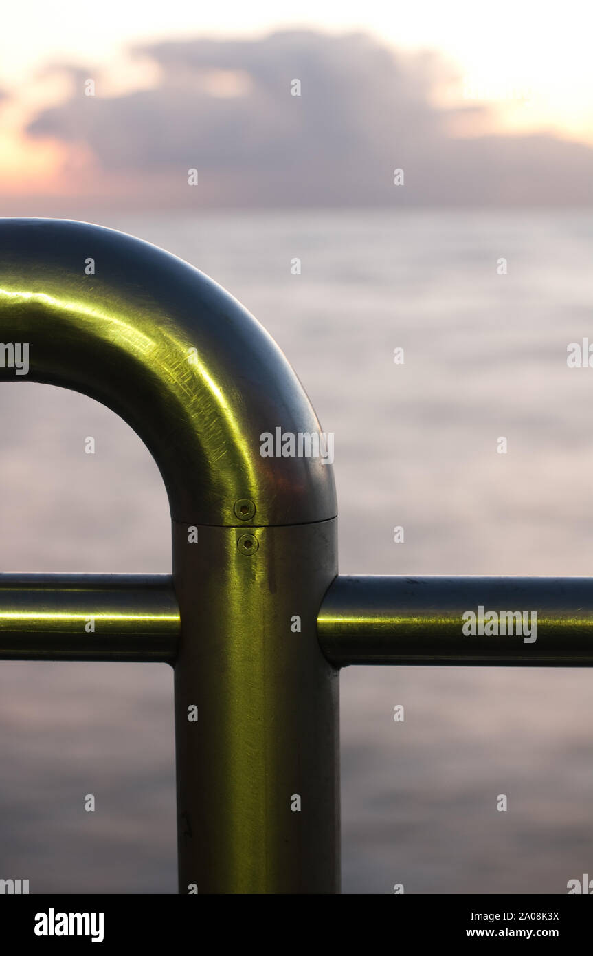 Metal railing by the beach in tuscany Stock Photo - Alamy