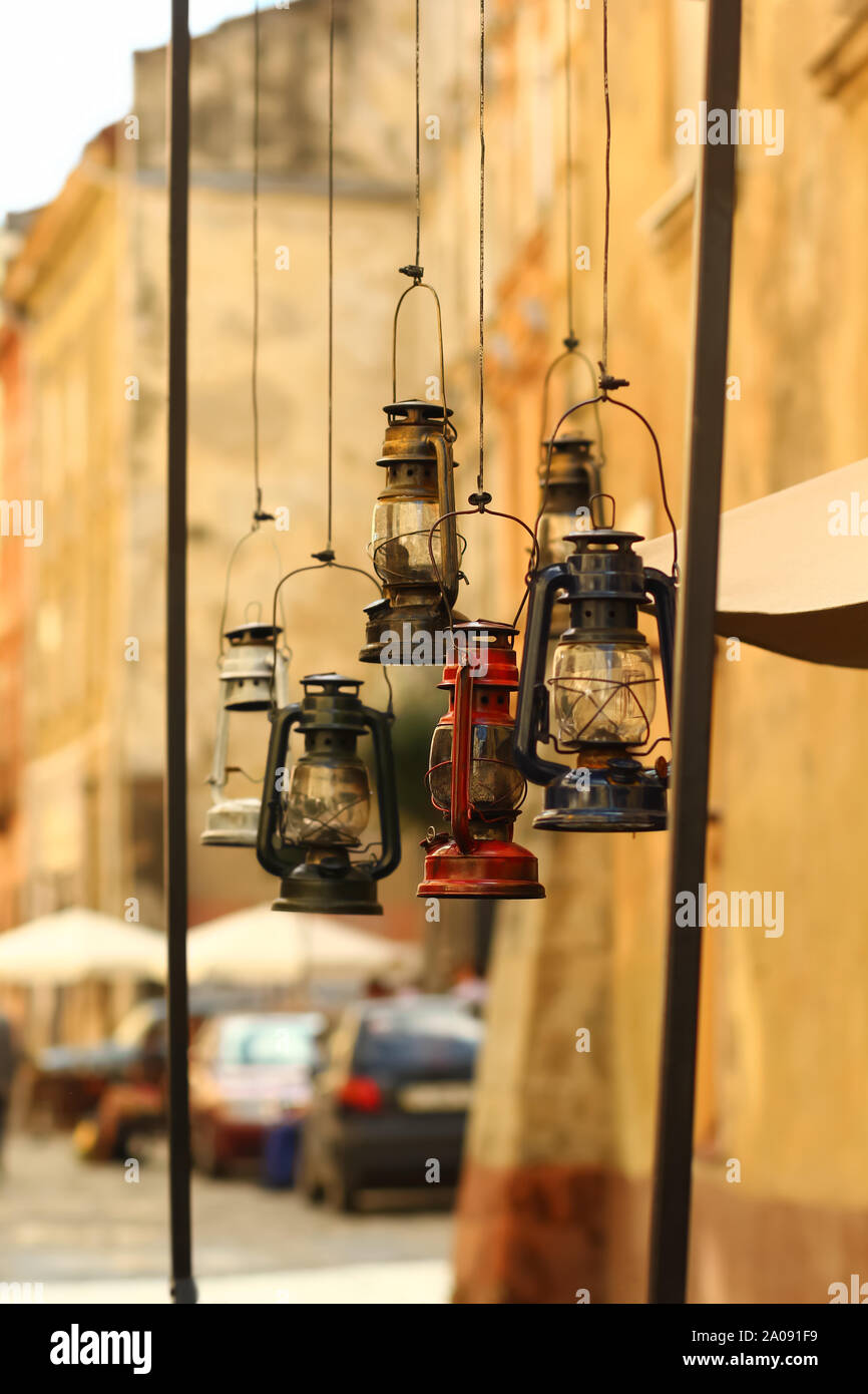 Hanging colorful vintage gas lamps, outdoor cafe decor Stock Photo - Alamy