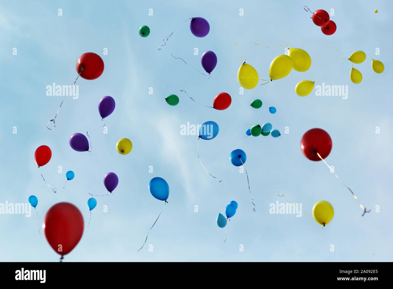 Colorful helium filled air balloons flying high in the sky Stock Photo ...