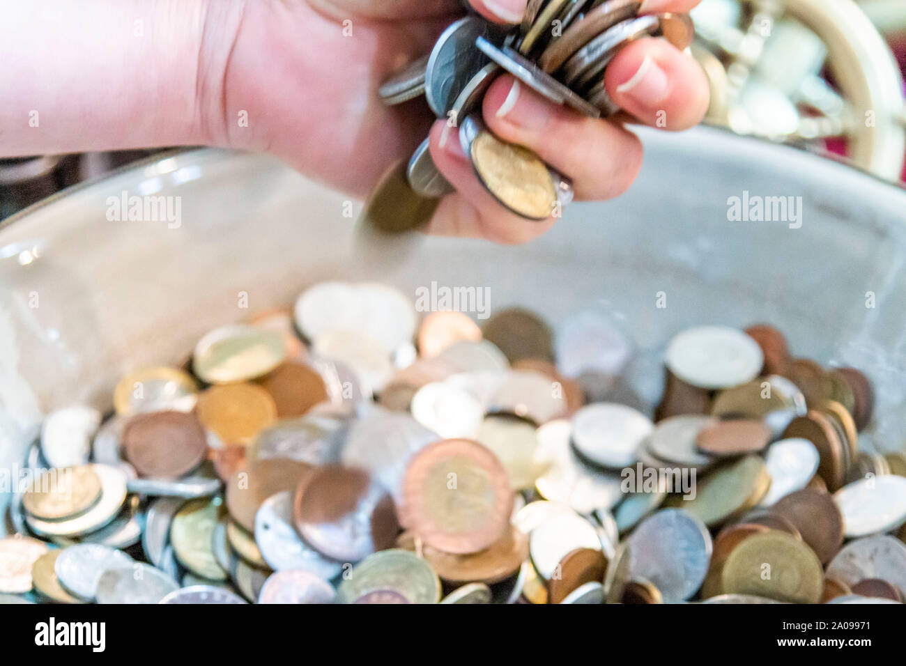 Old antique coins on display in antique shop Stock Photo - Alamy