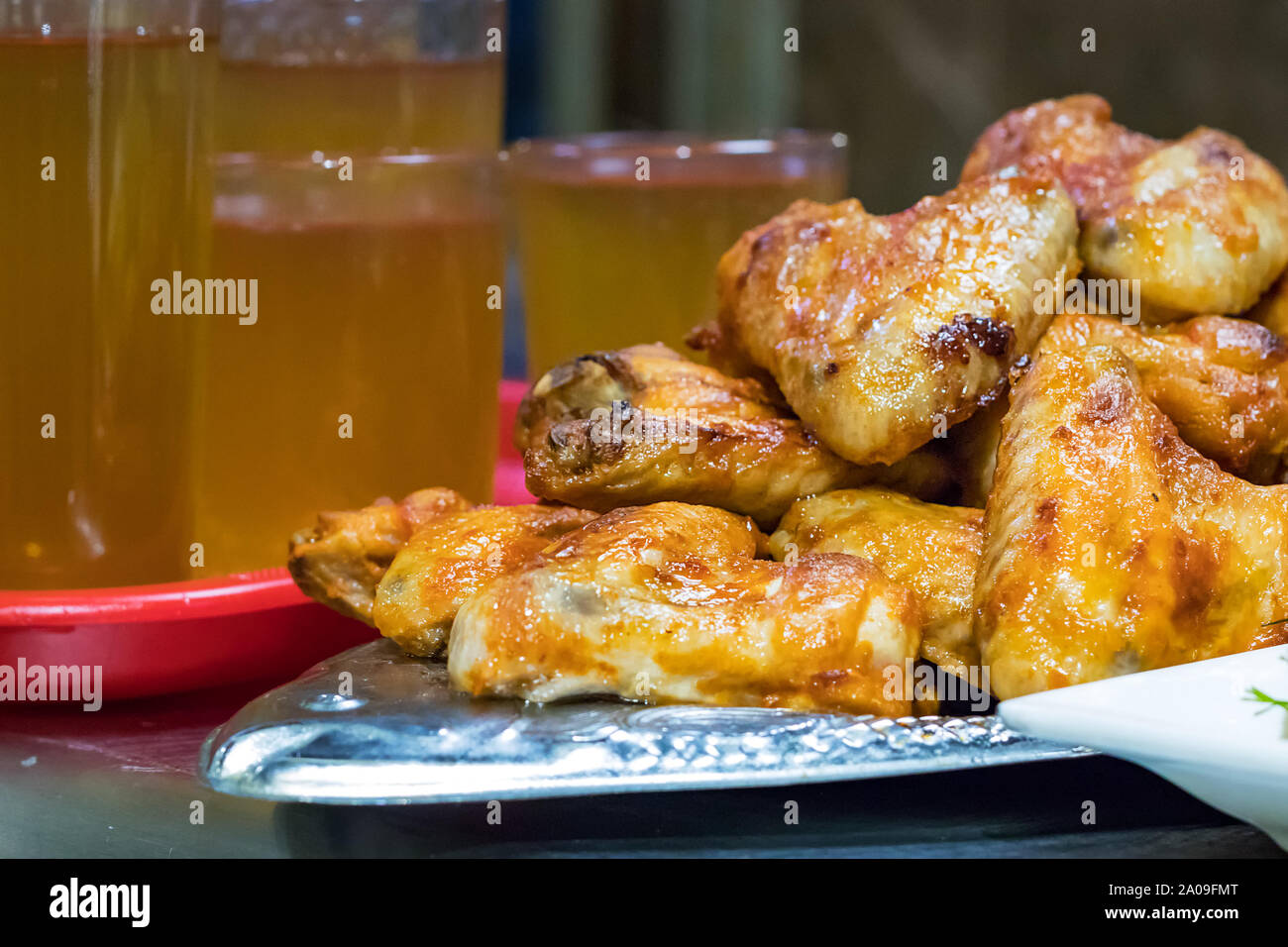 Chicken wings in tray hi-res stock photography and images - Alamy