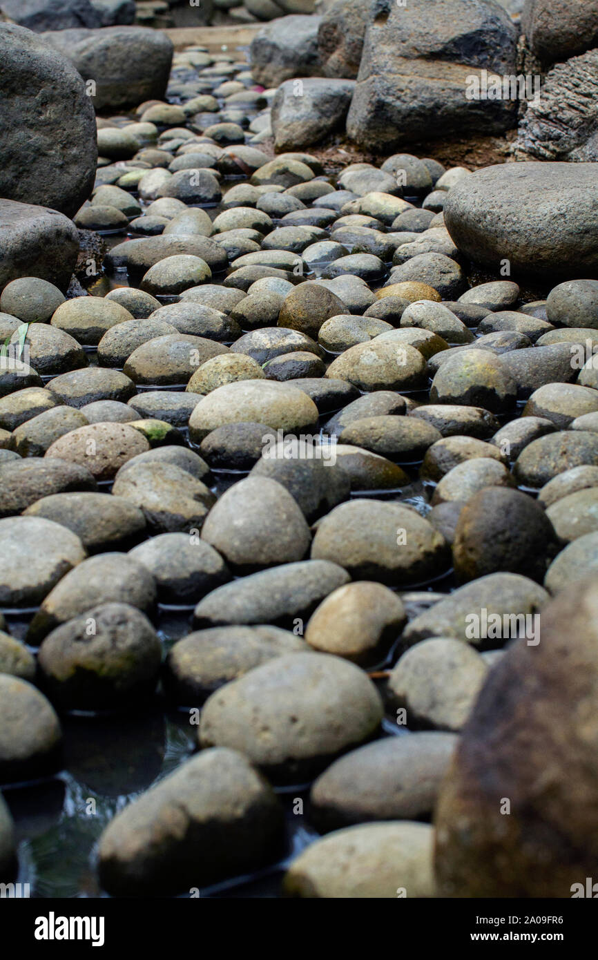 Beautiful naturally rounded stones in the dry pond Stock Photo - Alamy