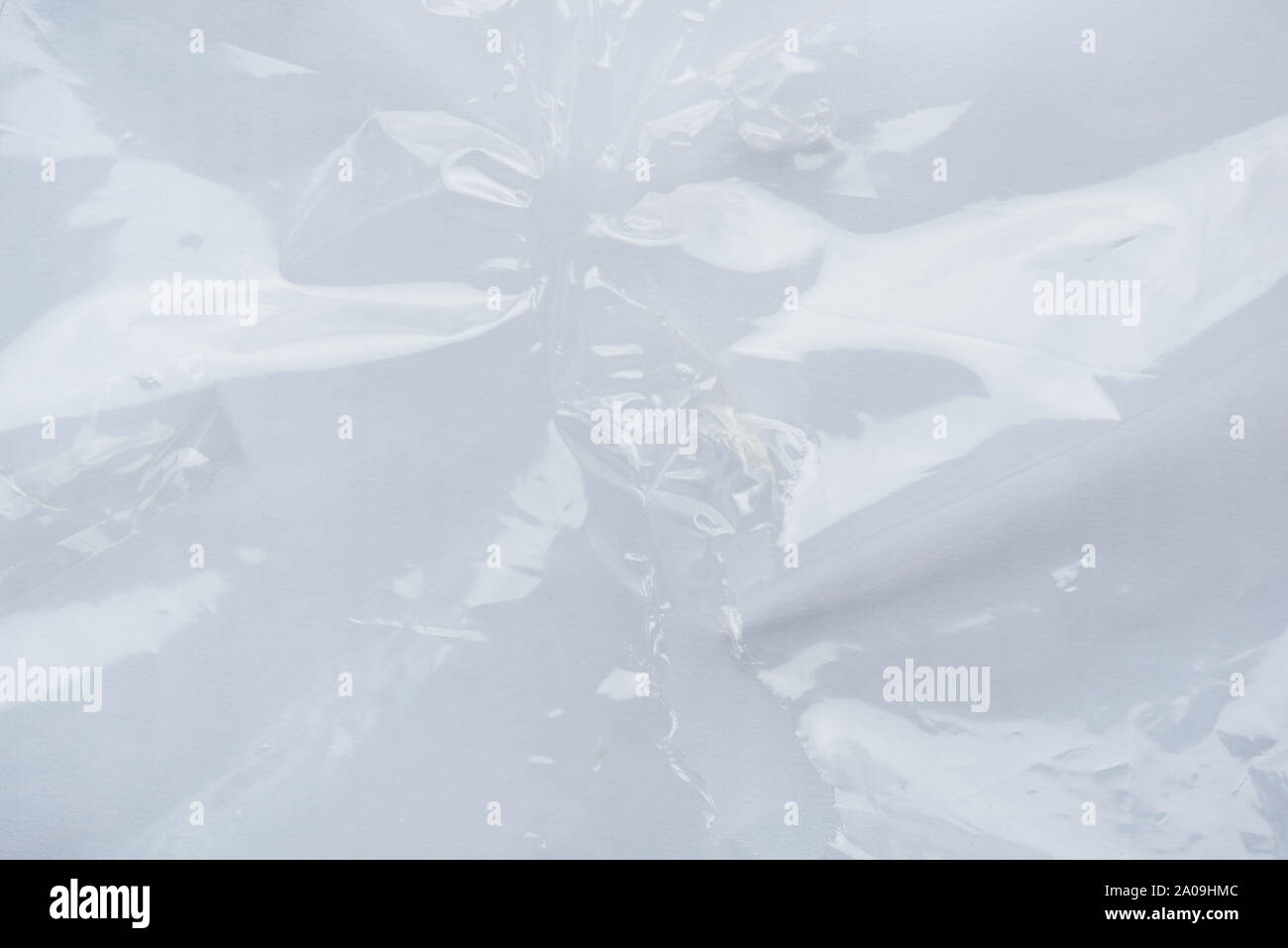 Transparent wrinkled plastic background close up view Stock Photo - Alamy