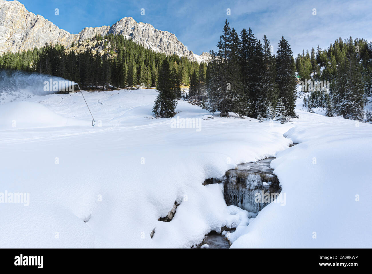 Winter landscape in the Austrian Alps. Frozen creek surrounded by ...