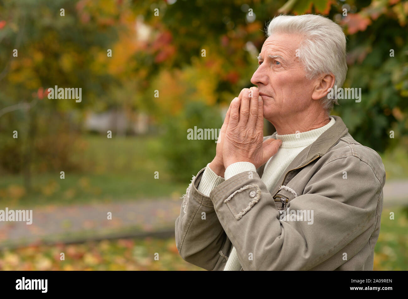 Caucasian elderly male praying hi-res stock photography and images - Alamy