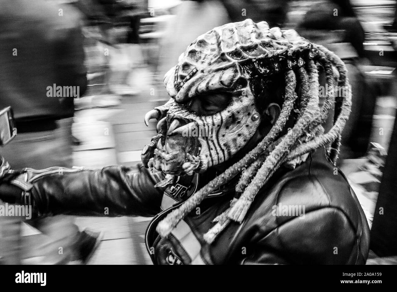 Scary Creature Riding Motorcycle in Parade Stock Photo - Alamy