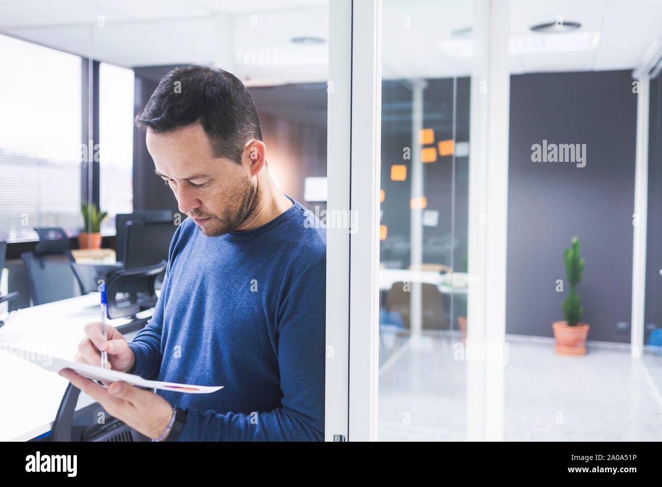 Serious business man reading documents hi-res stock photography and ...