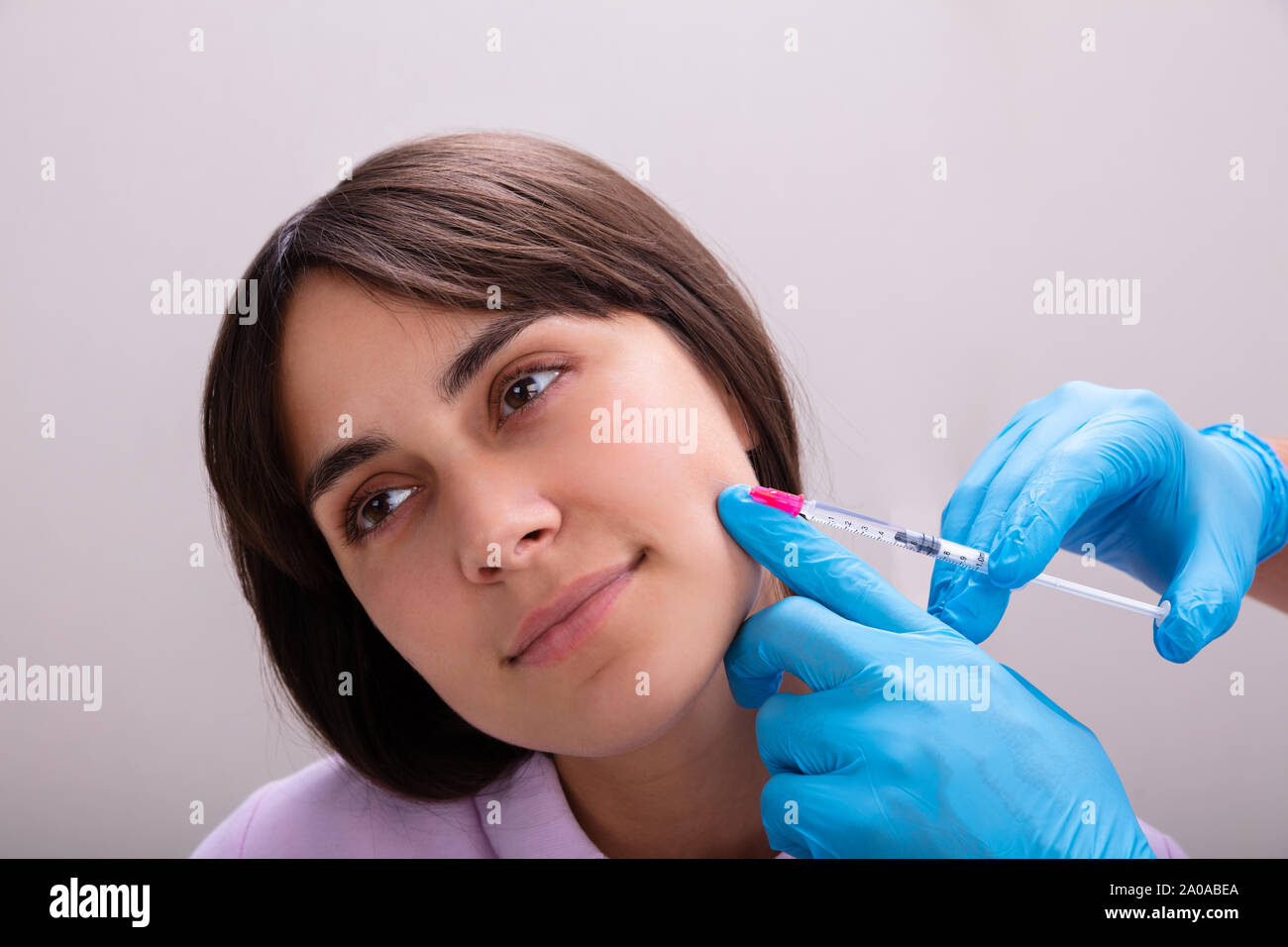 Woman getting an injection hi-res stock photography and images - Alamy