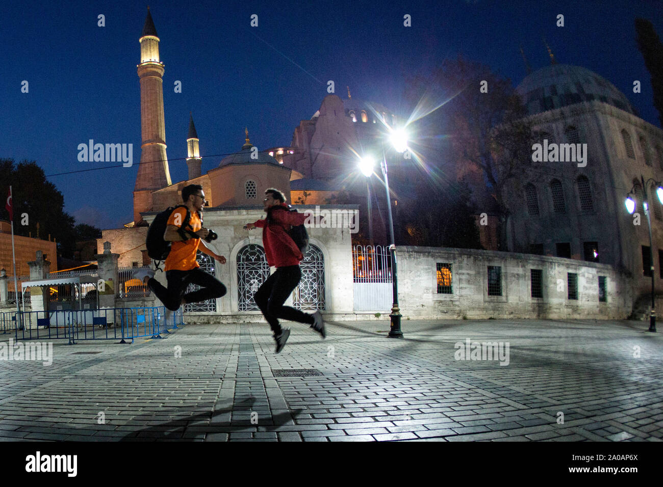 Two men jumping in night. Saint Sophia Museum. Istanbul Stock Photo - Alamy