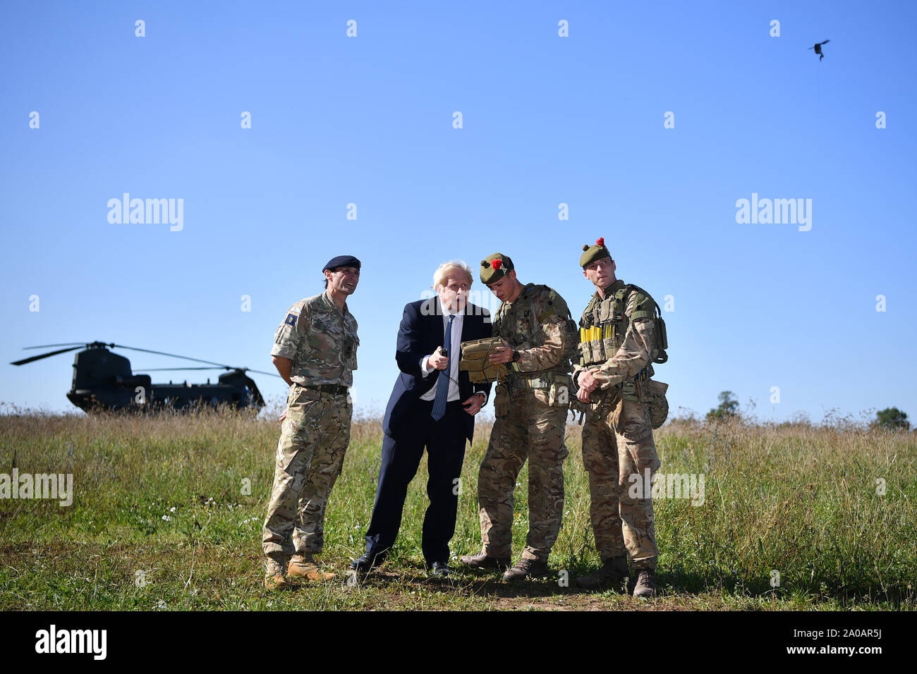 Prime Minister Boris Johnson flies a Black Hornet nano drone (top ...