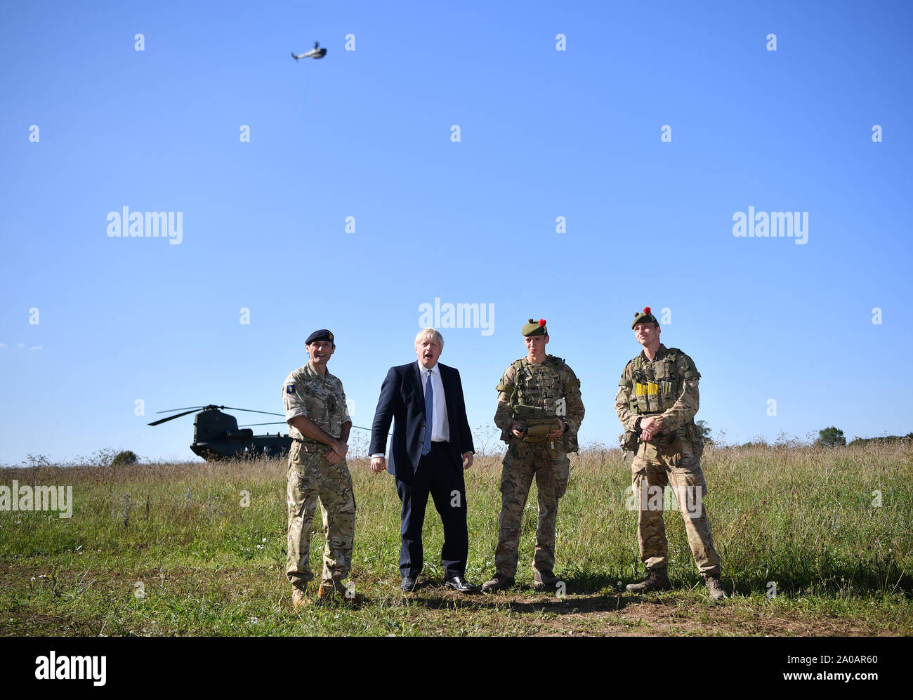 Prime Minister Boris Johnson is shown a Black Hornet nano drone (top ...