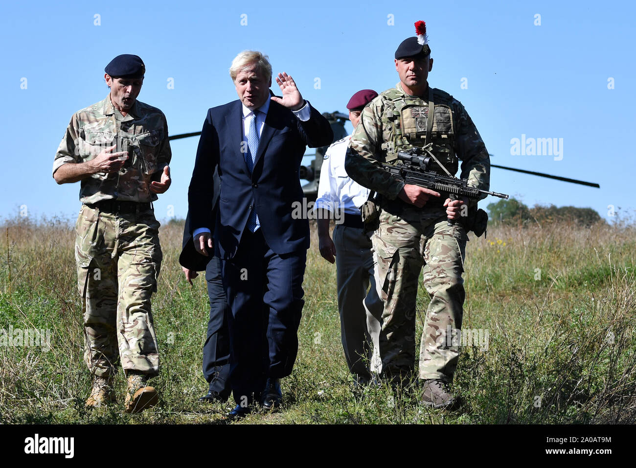 Prime Minister Boris Johnson arrives in a chinook helicopter to visit ...