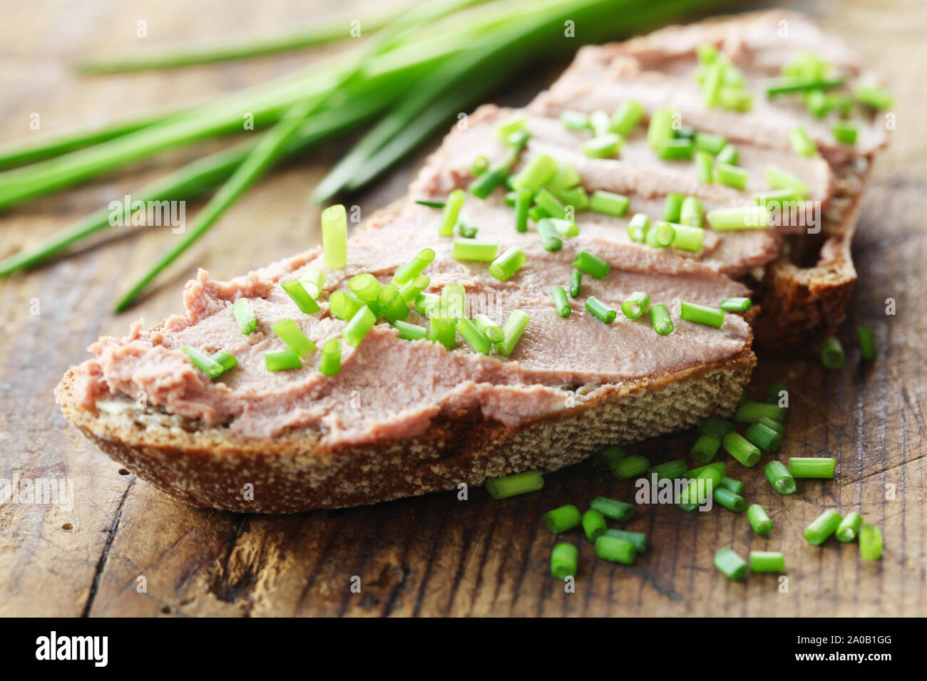 A Slice Of Bread With Liver Pate And Chives Stock Photo - Alamy