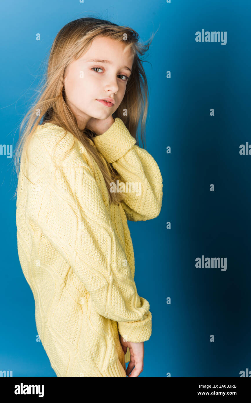 Beauty or kid fashion with cosmetics and healthy hair. Stylish girl ...