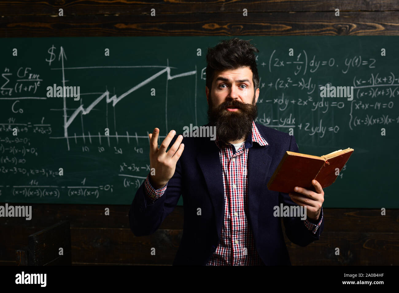 In teachers classroom. Old books on a round wooden table. Home tutor ...