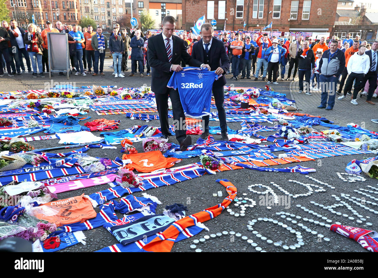 Gregory Vignal (left) and Thomas Buffel lay a shirt next to the floral ...