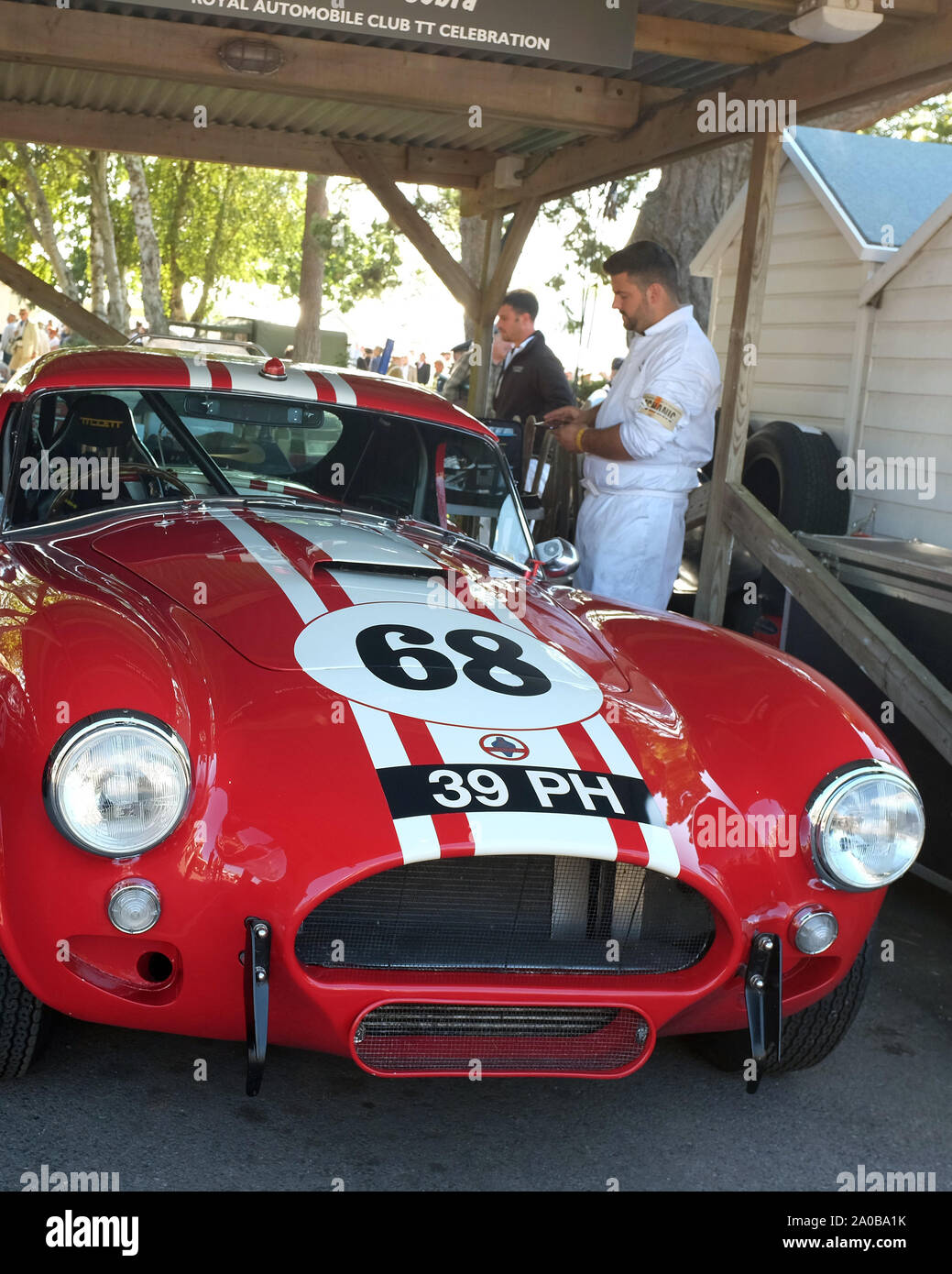 September 2019 - Red AC Cobra race cars in the paddock at Goodwood ...
