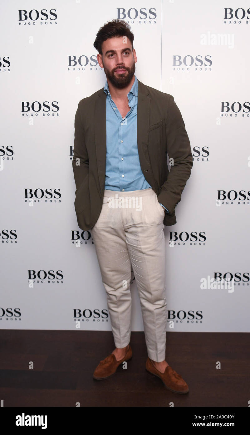 Timothy James attending the christening ceremony for the Hugo Boss ...