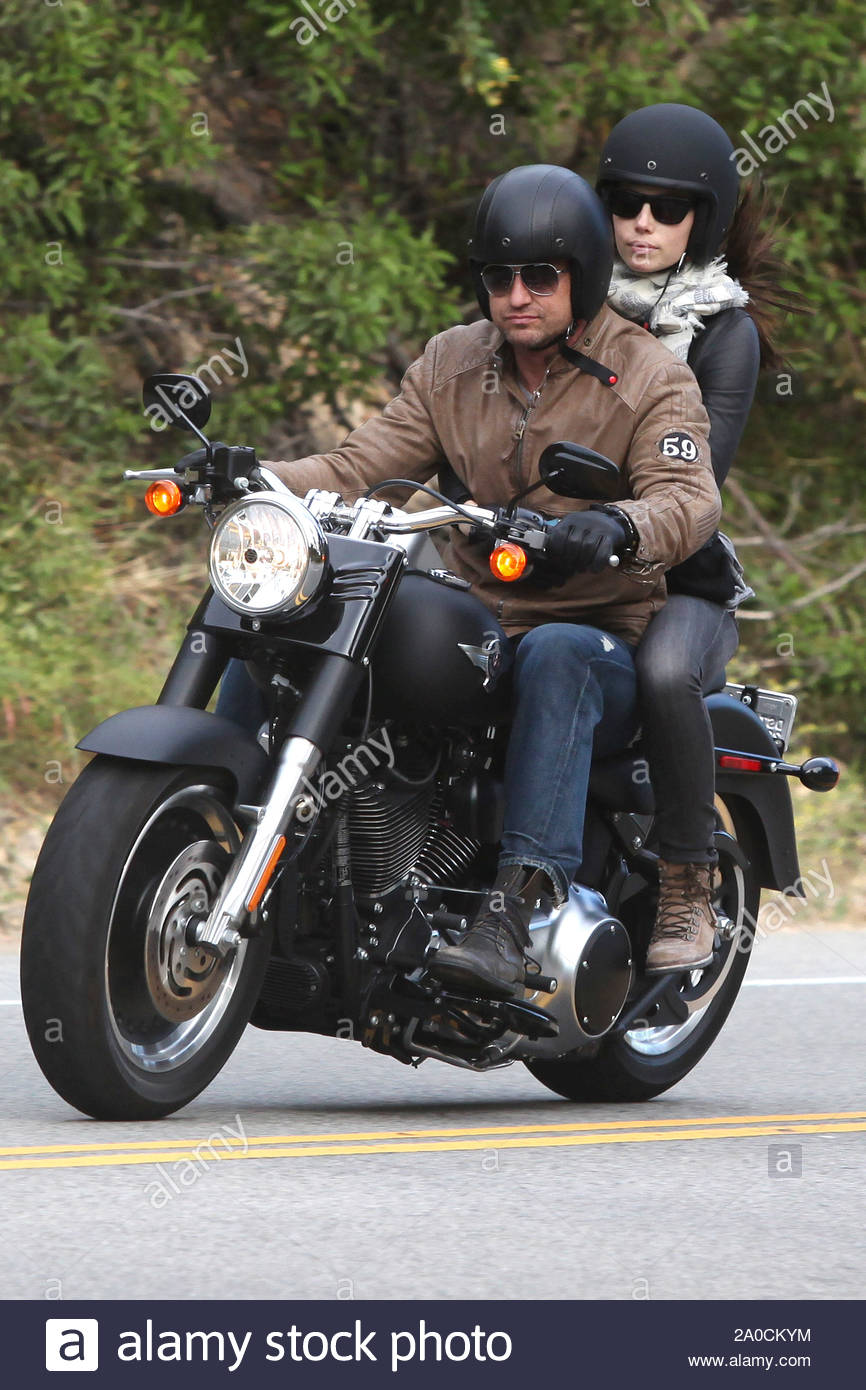 Couple Riding Harley Davidson Motorcycle Stock Photos & Couple Riding ...