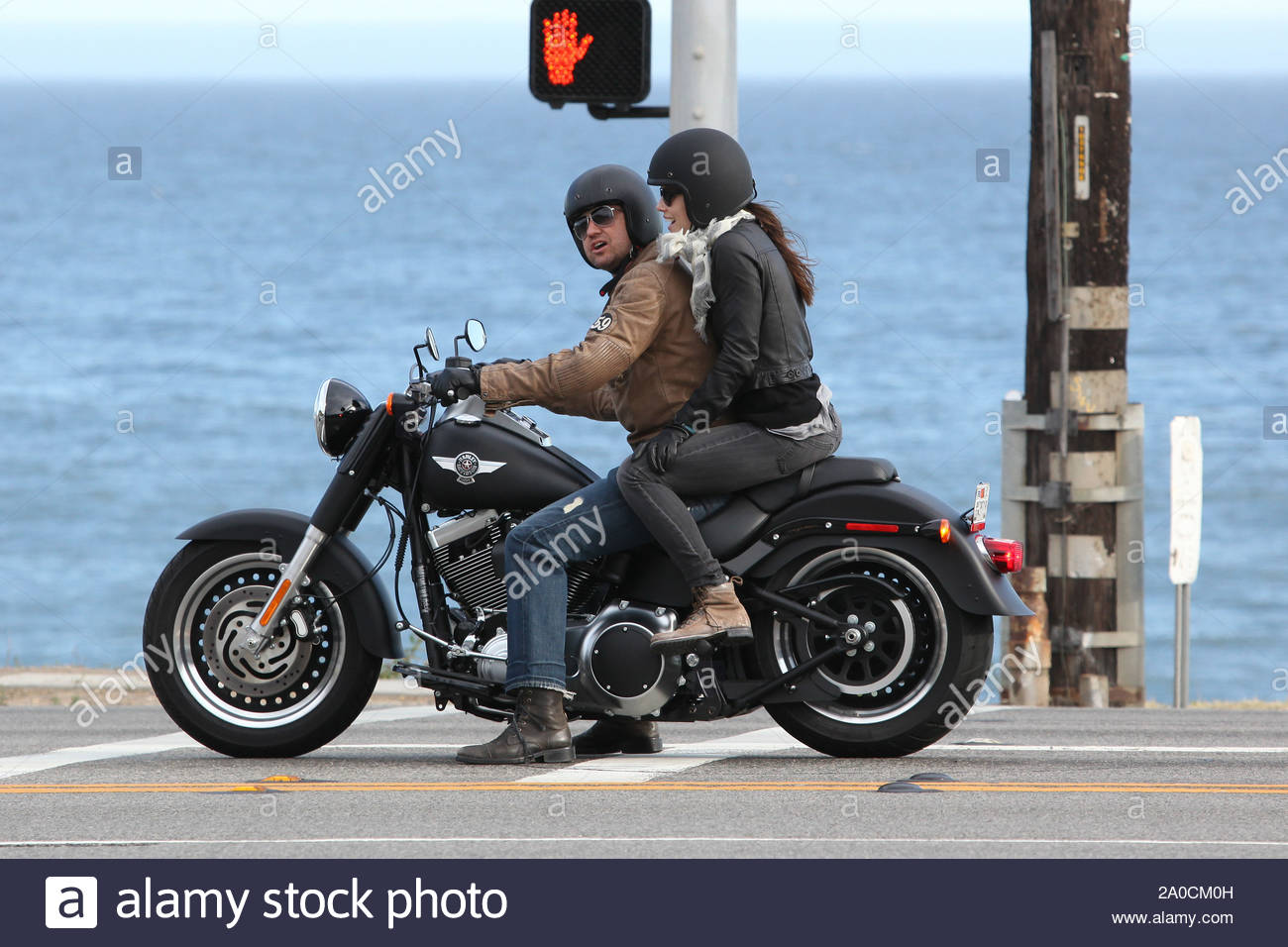 Couple Riding Harley Davidson Motorcycle Stock Photos & Couple Riding ...