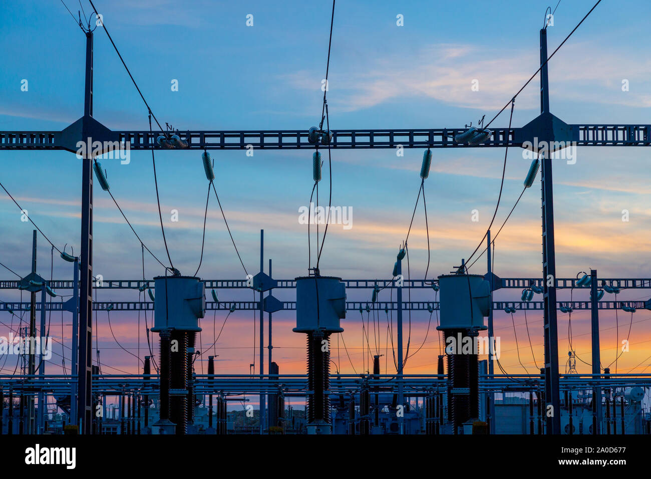 high-voltage power lines at electricity distribution station with ...