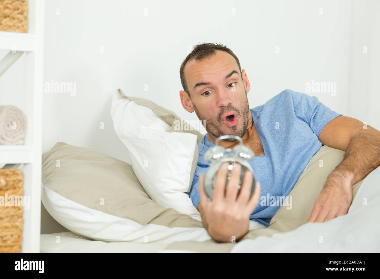 man shocked as he wakes up late for an appointment Stock Photo - Alamy
