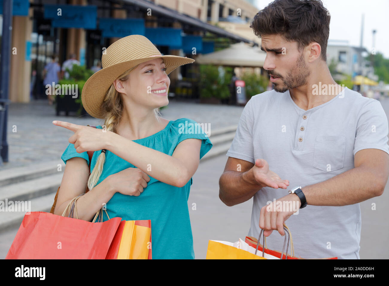 boyfriend arguing to stop shopping Stock Photo - Alamy