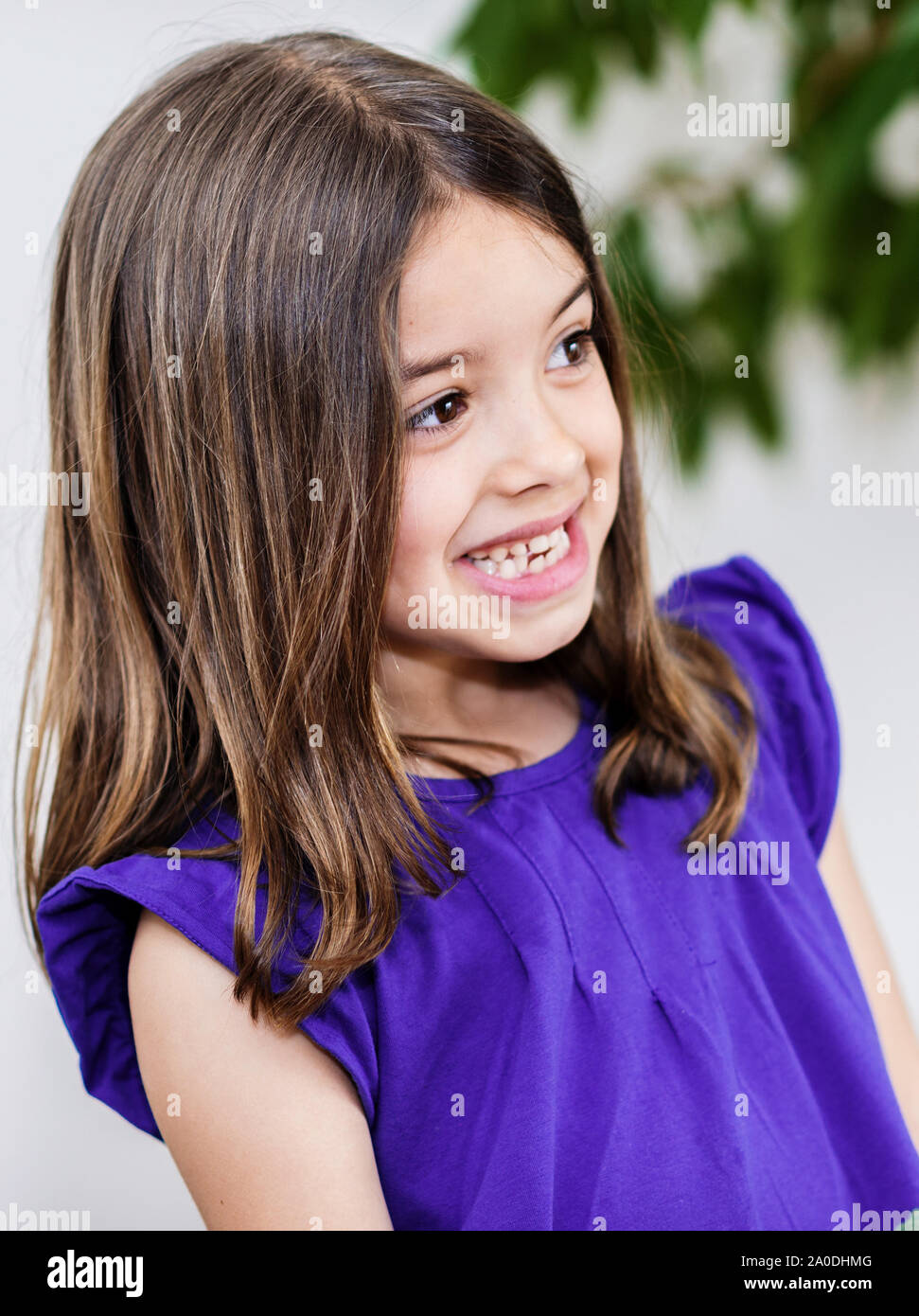 Expressive portrait of very cute girl smiling child Stock Photo - Alamy