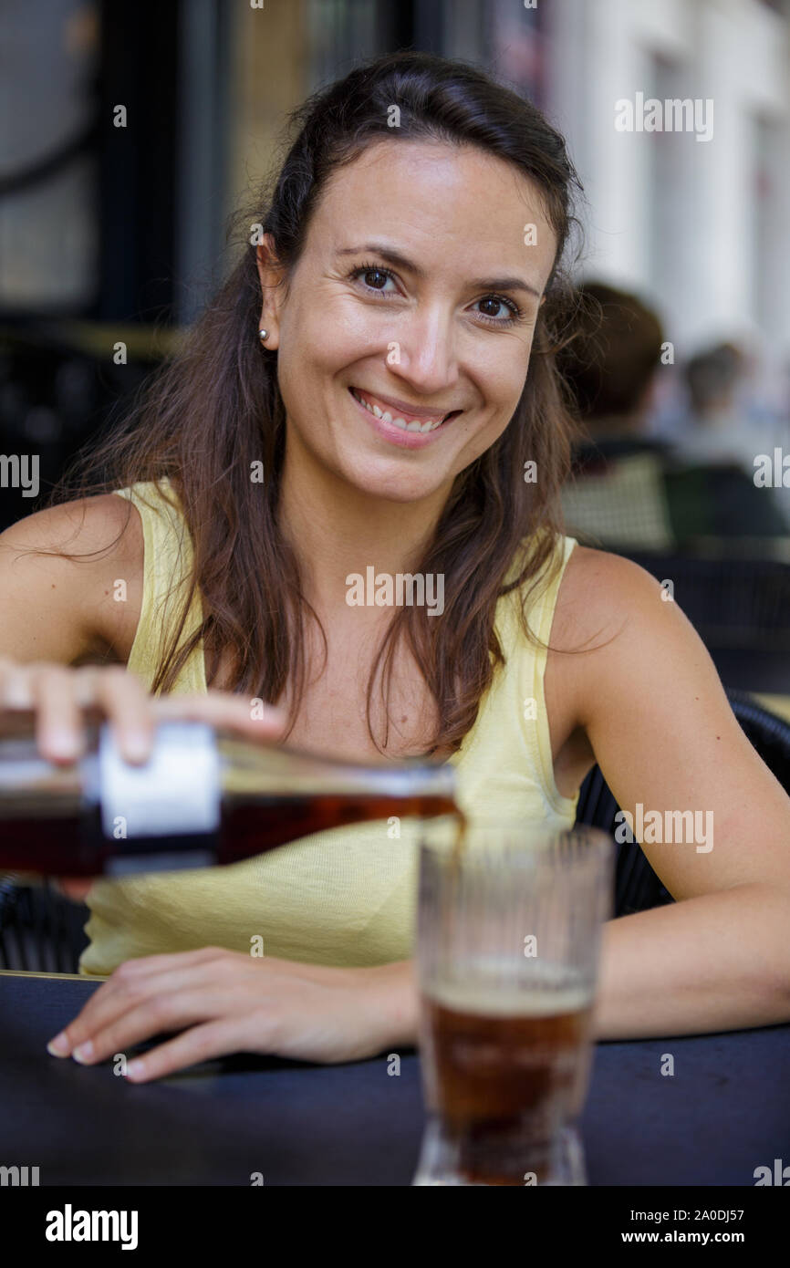 a happy woman drinking sofa Stock Photo - Alamy
