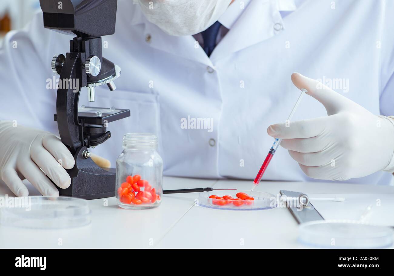 The doctor testing new drugs for medical purposes Stock Photo - Alamy