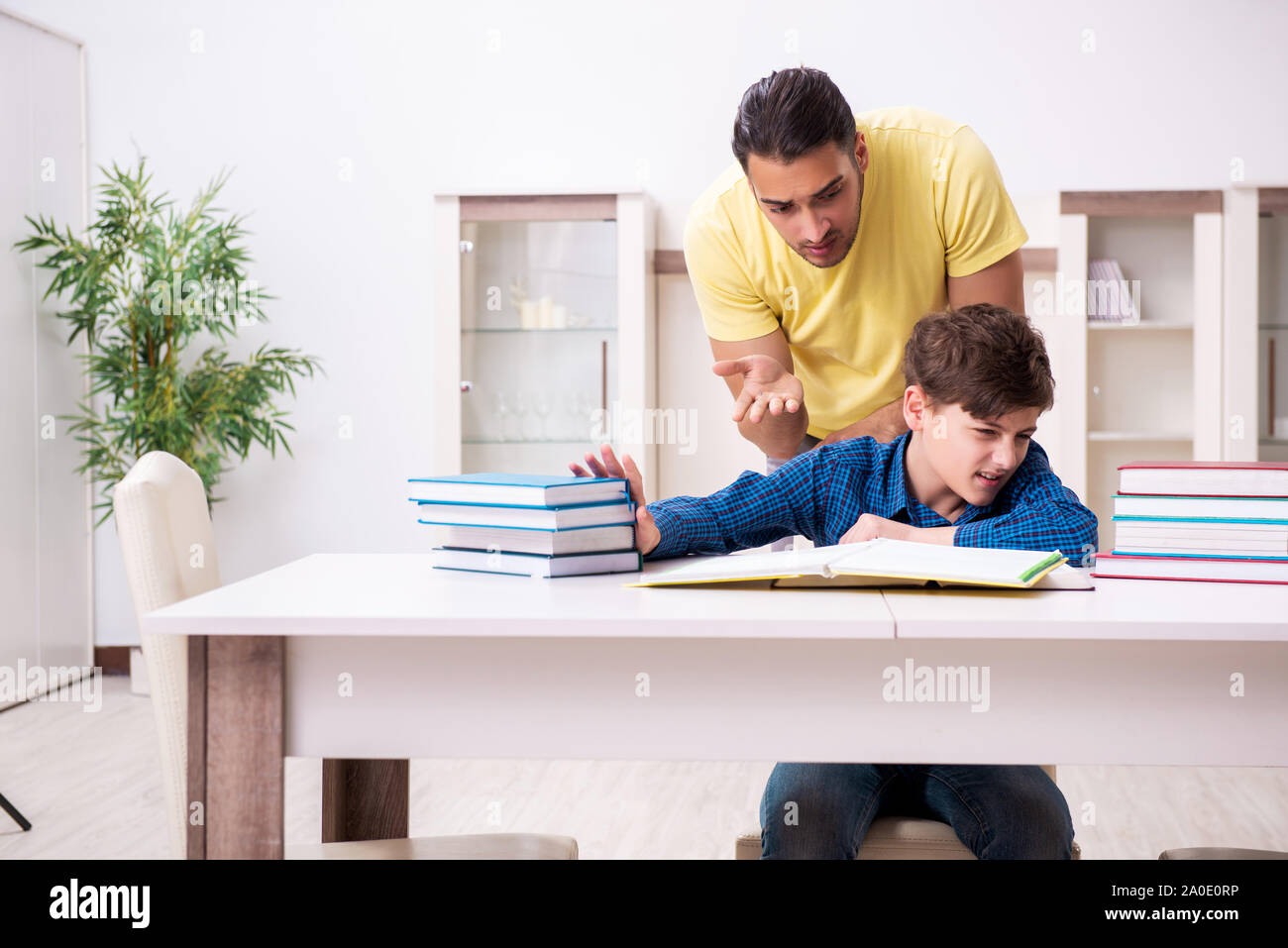 The father helping his son to prepare for school Stock Photo - Alamy