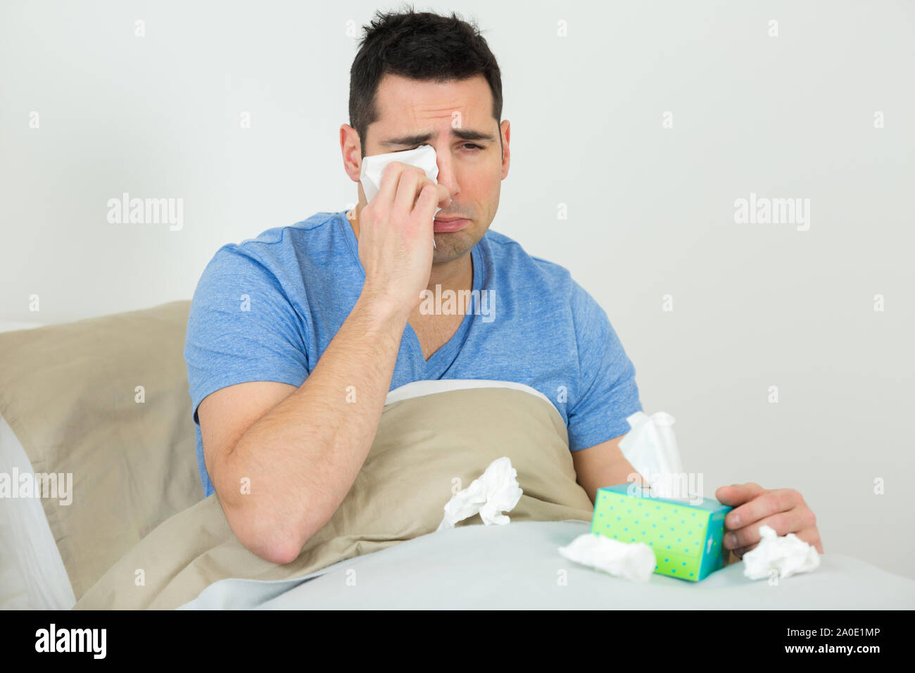 sad single man lamenting sitting on the bed Stock Photo - Alamy