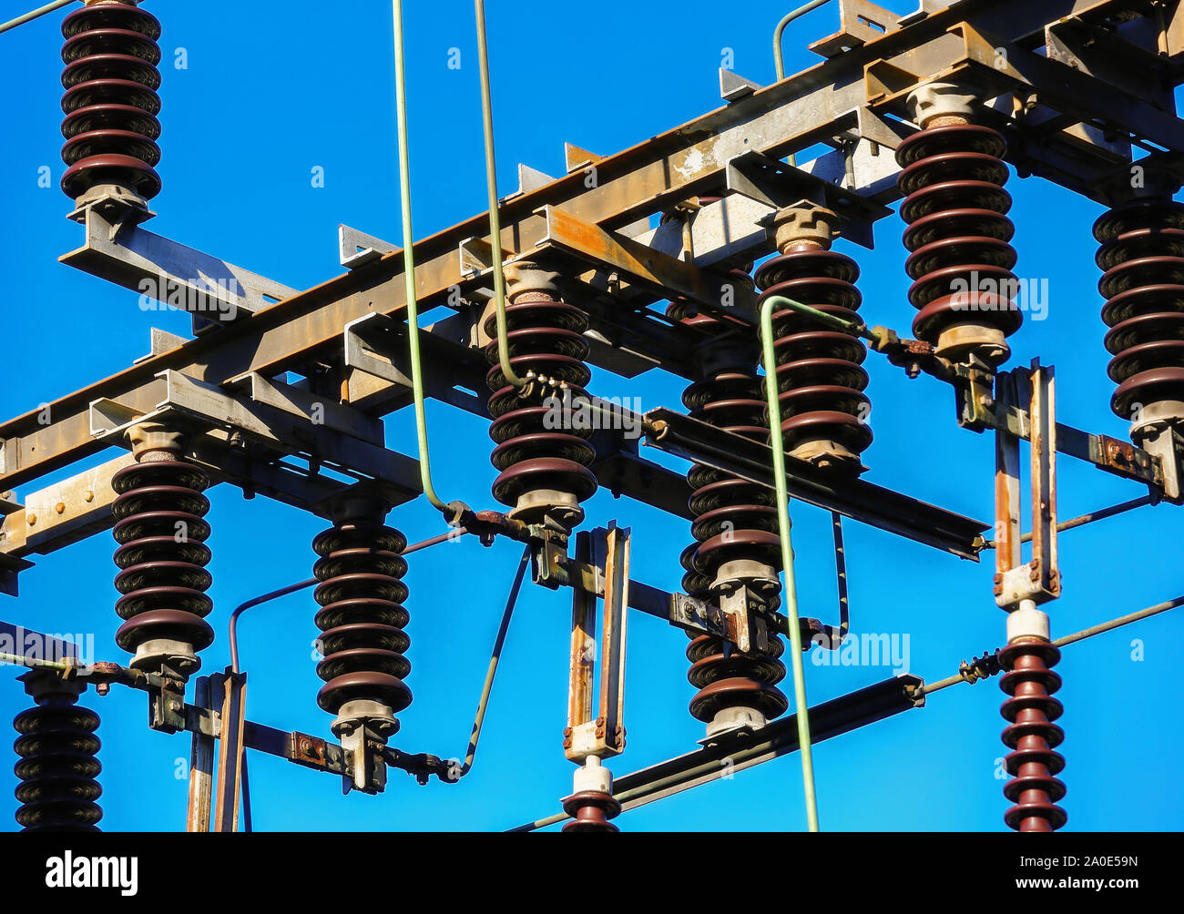 high-voltage power lines at electricity distribution station with ...