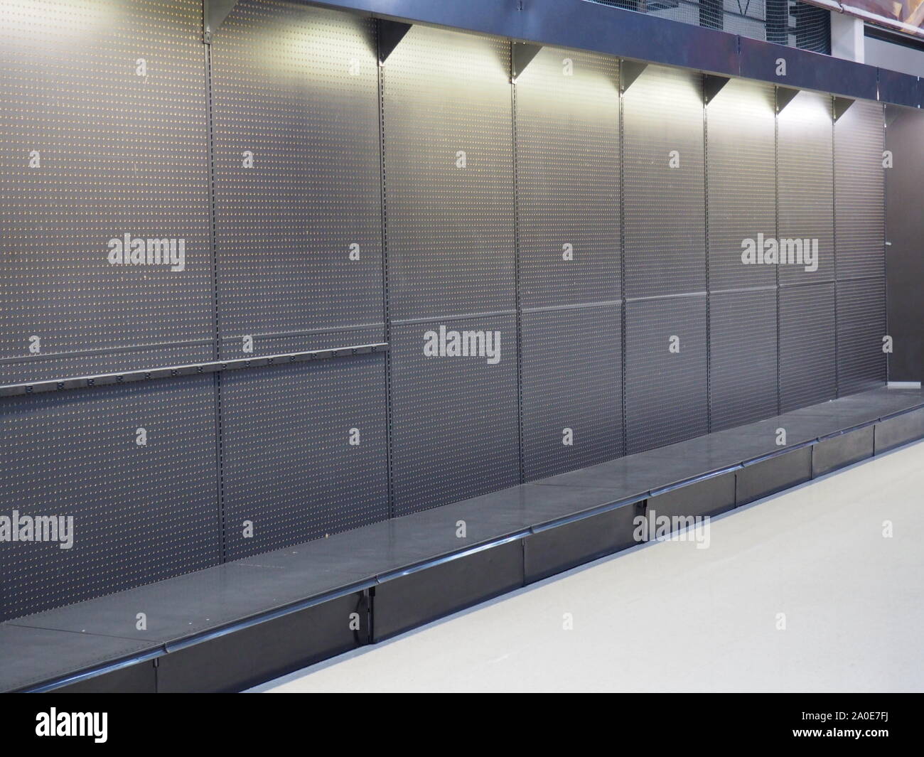 Business looking sad and depressed with empty display shelves Stock ...
