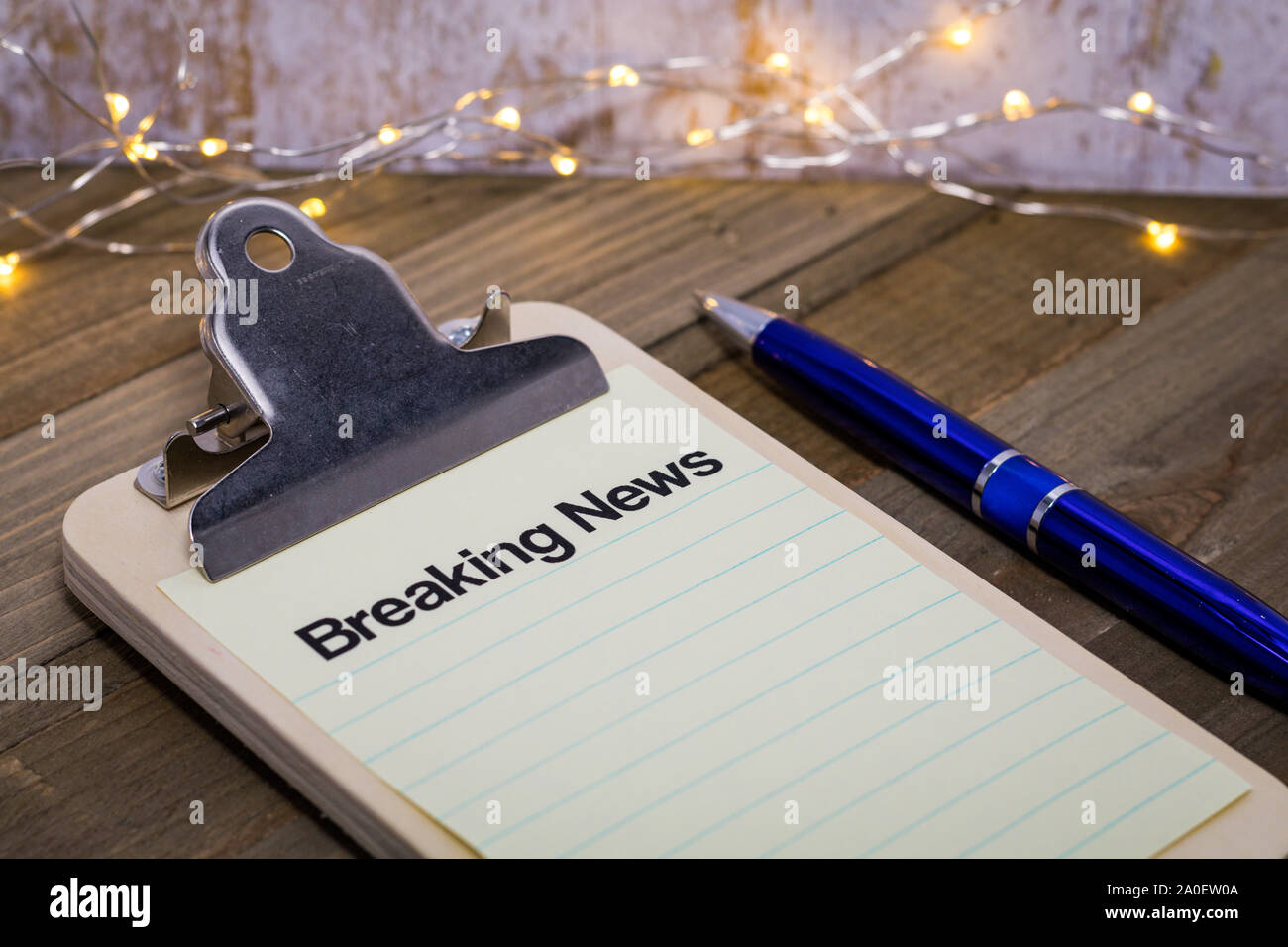 Breaking News concept with words on handheld paper, clipboard and ...