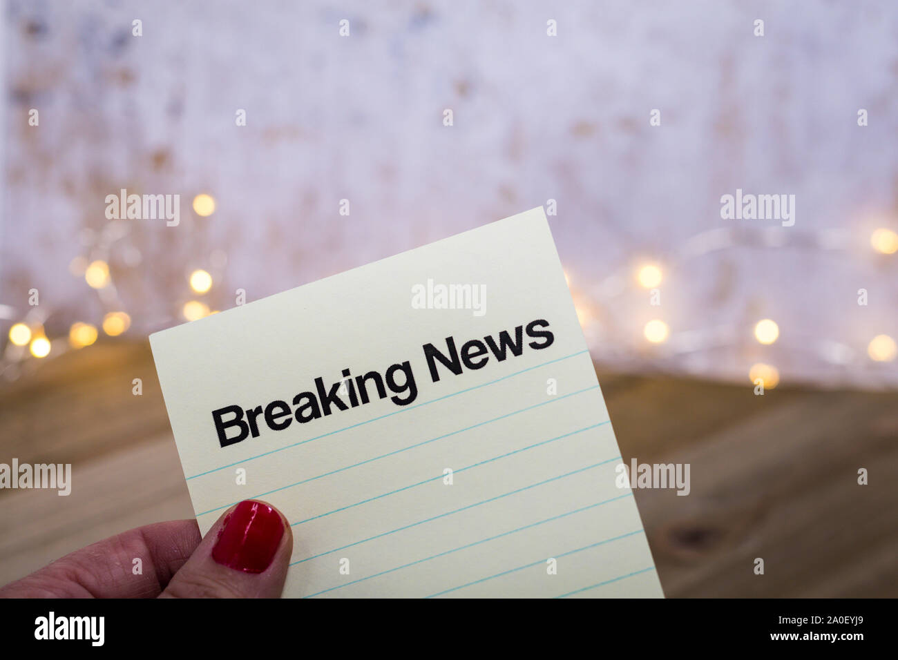 Breaking News concept with words on handheld paper, clipboard and ...